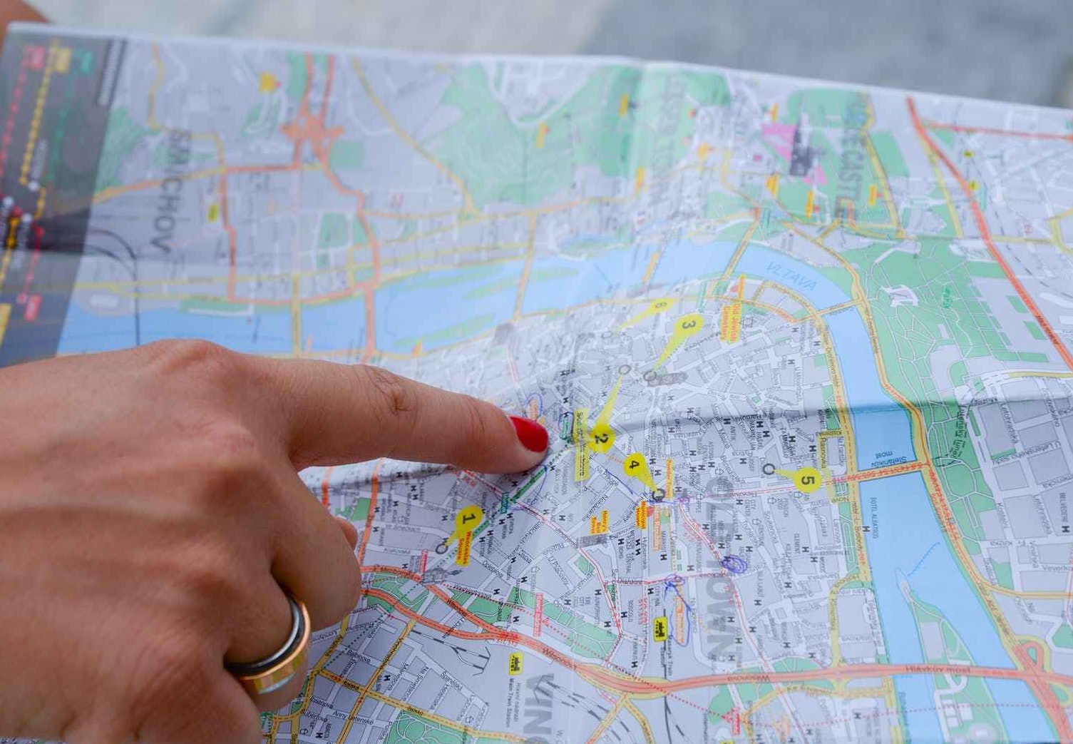 person pointing map chart